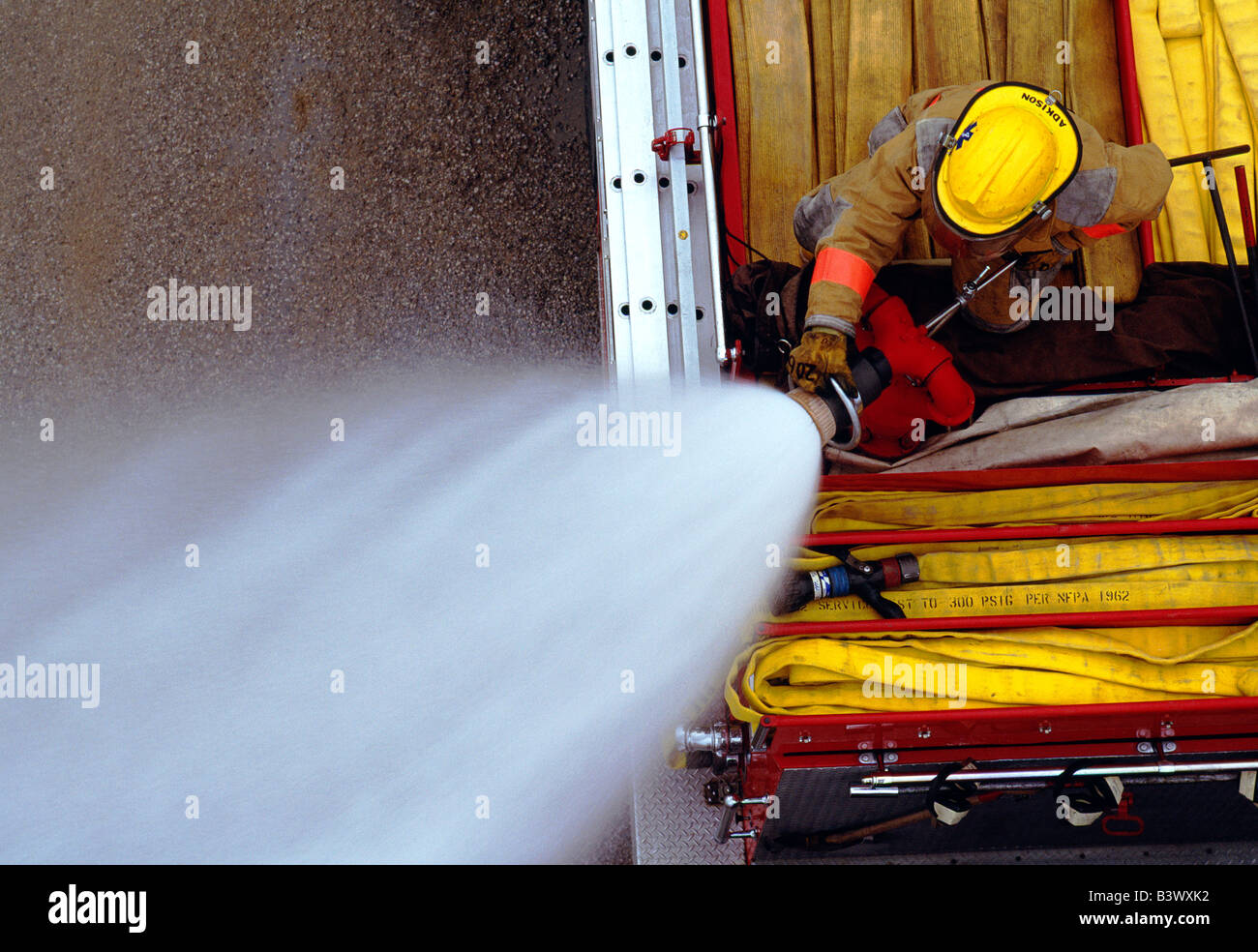 Fireman kneeling hi-res stock photography and images - Alamy