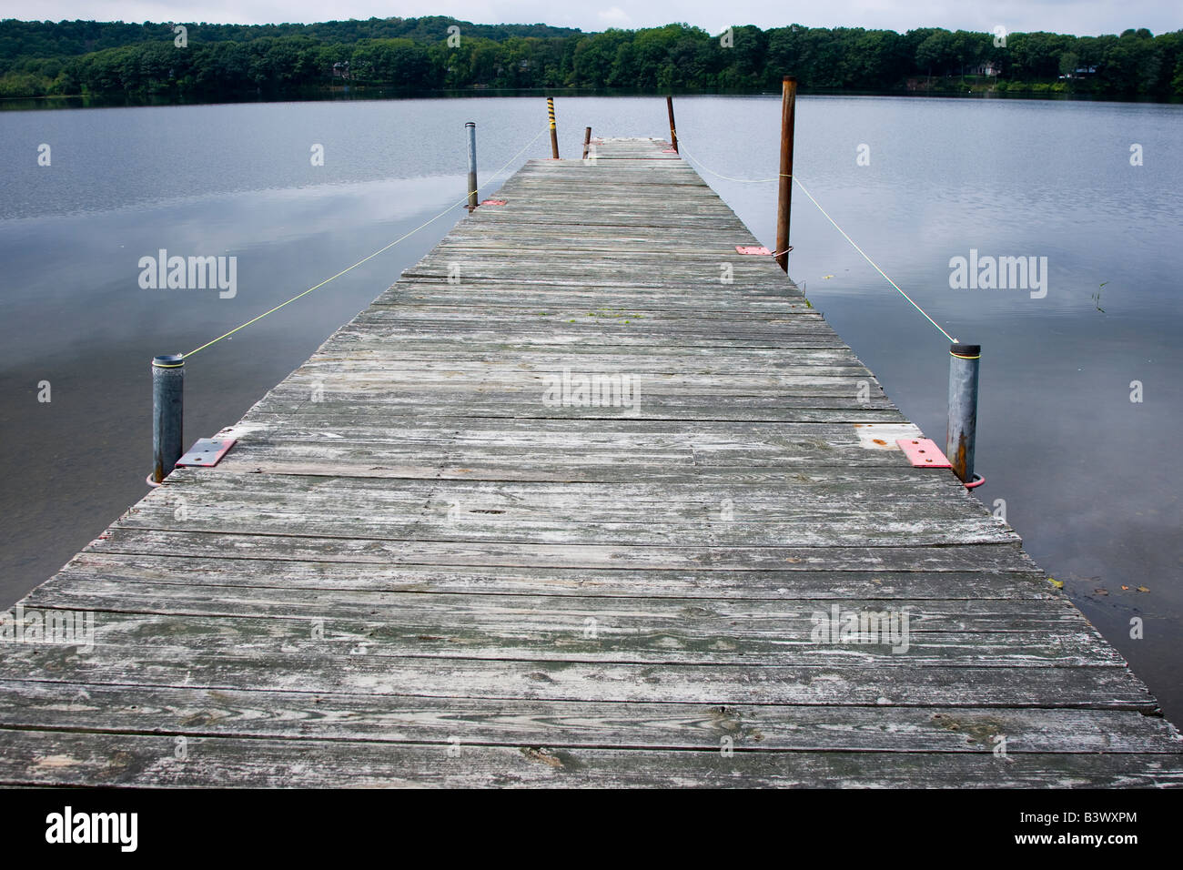 Pier leading into a lake Stock Photo - Alamy