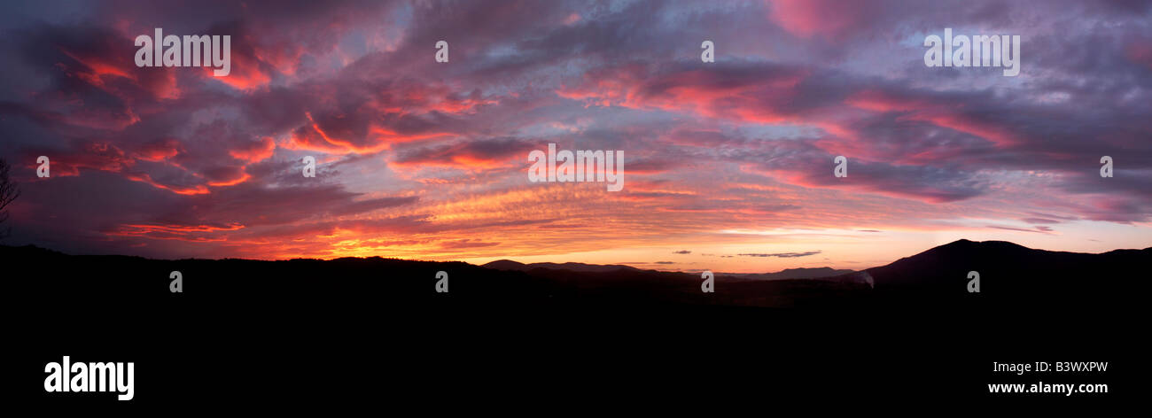 A dramatic sunset over the mountain ridge at Towamba in rural New South ...