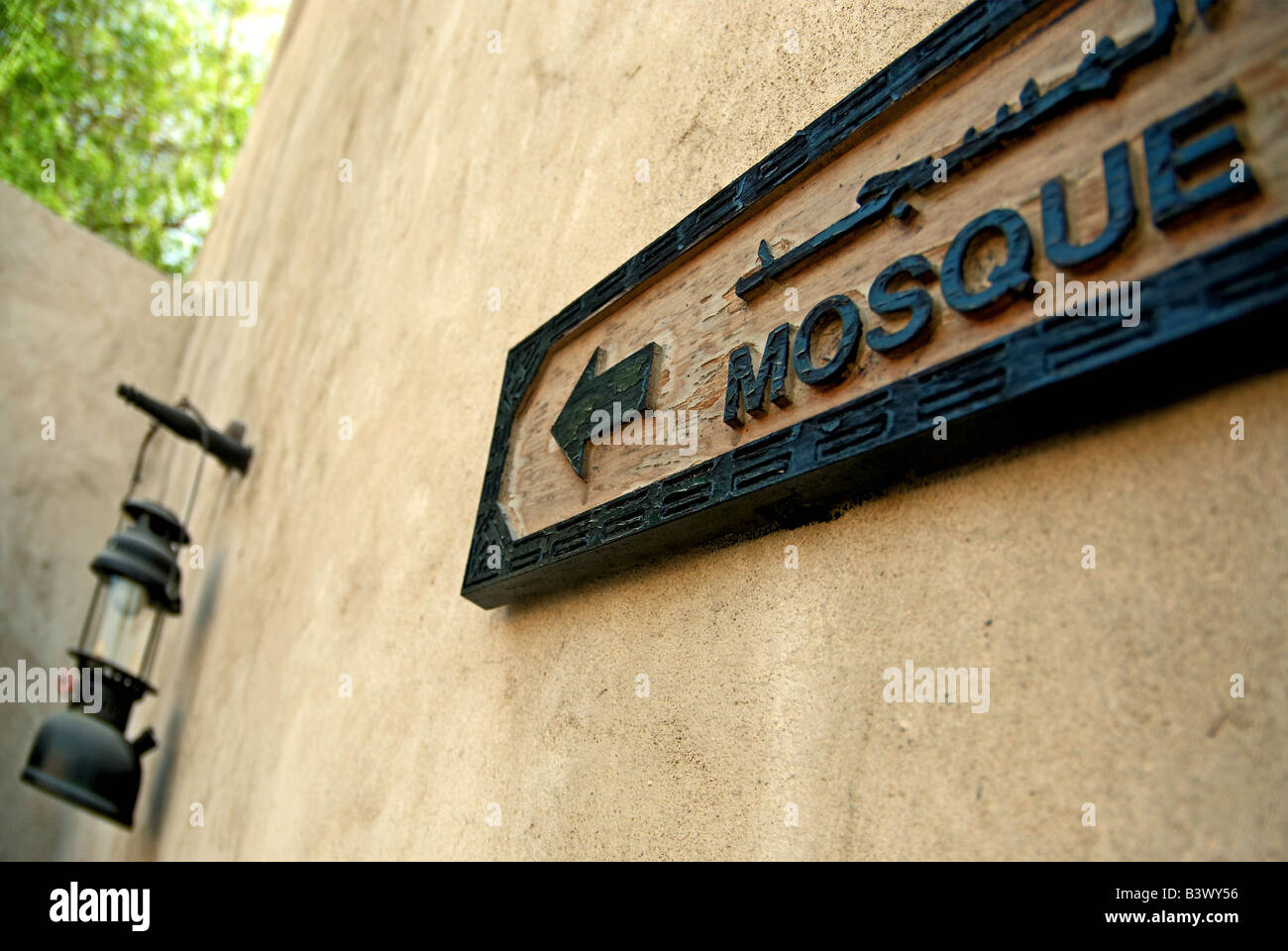 Sign showing the way to the next mosque in heritage area in Dubai Stock ...