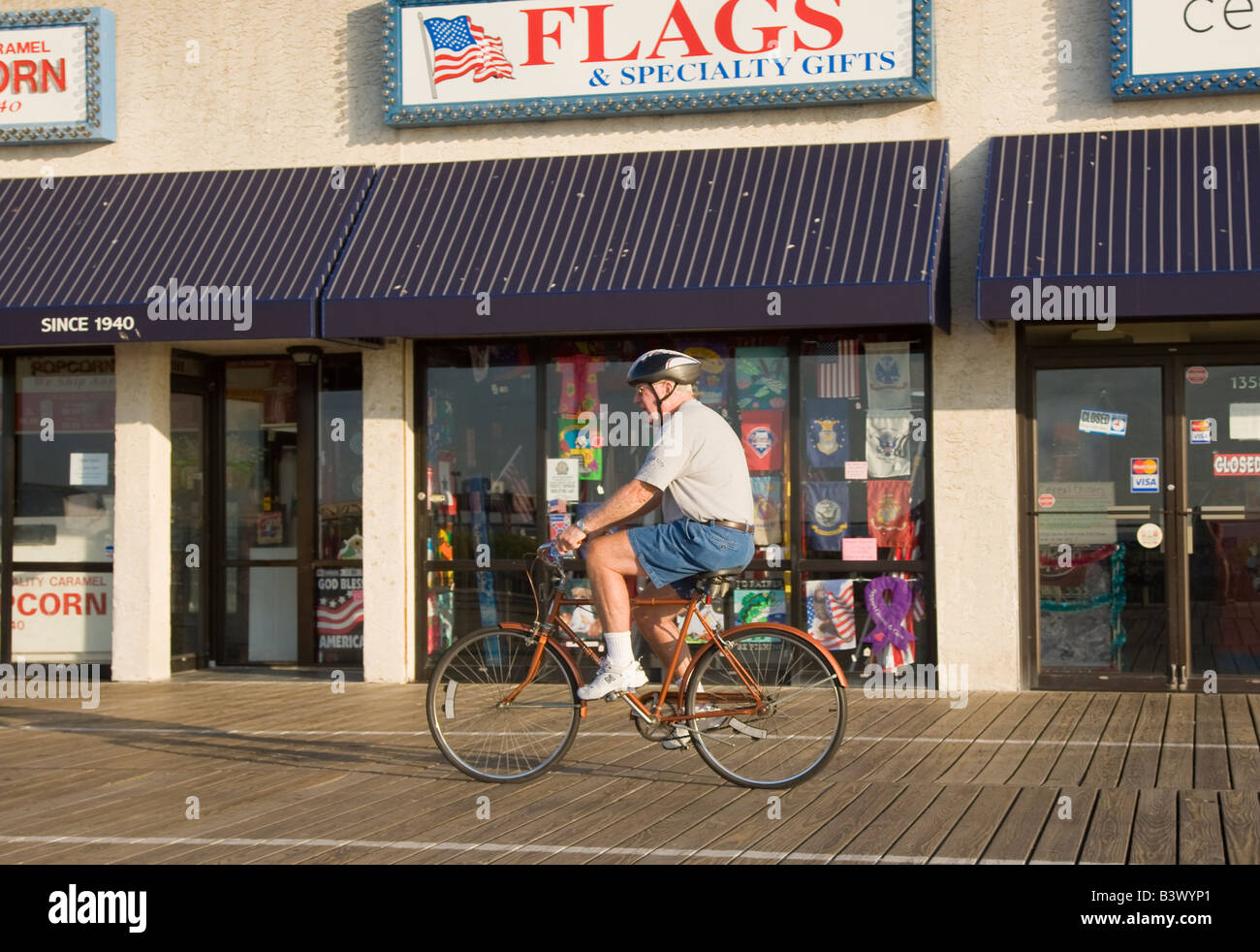 Man bicycling on the boardwalk Stock Photo - Alamy