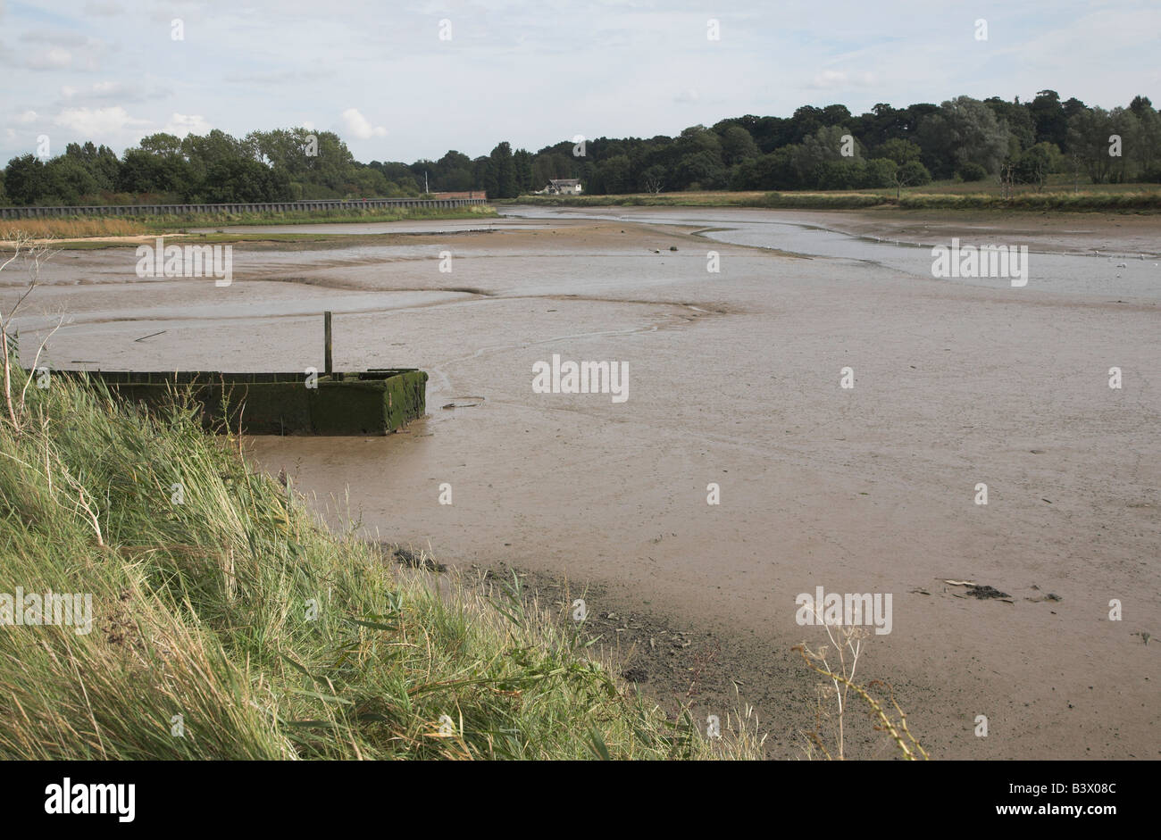 Mud banks and abandoned boat, River Deben, Melton, Suffolk, England ...