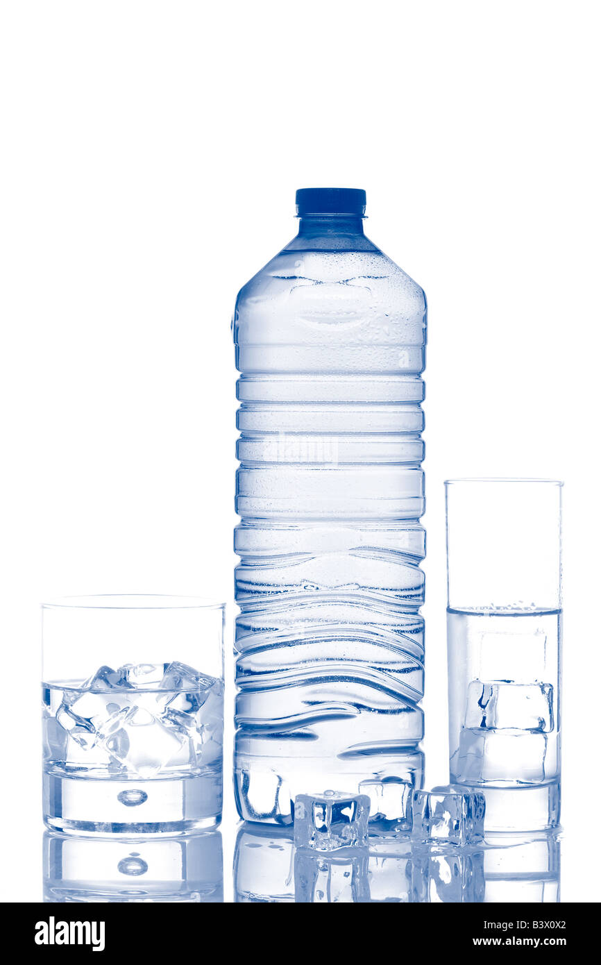 Bottle and glasses of mineral water with ice cubes reflected on white background Stock Photo - Alamy