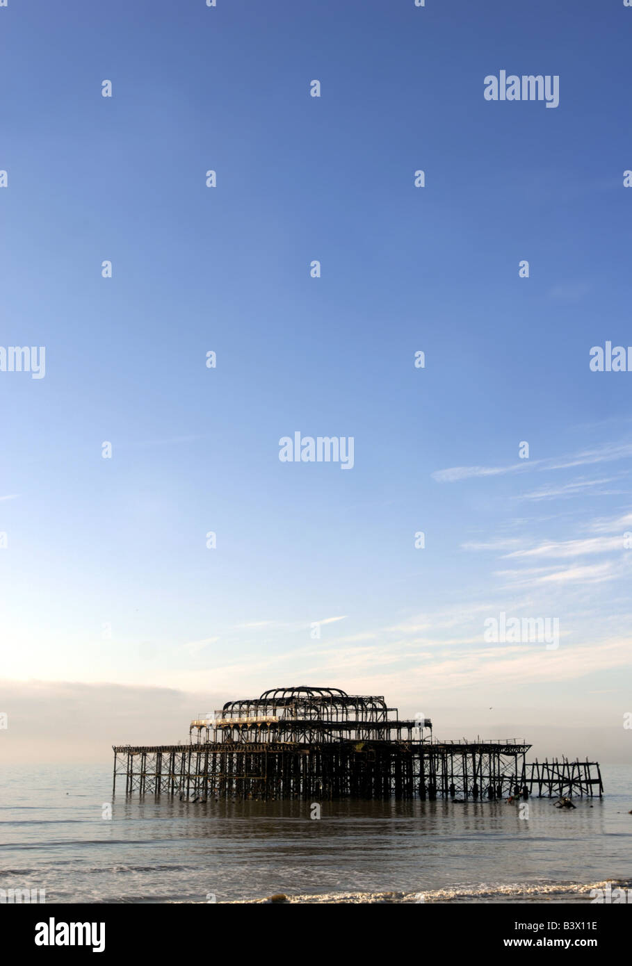 View at sun rise over the skeletal remains of the West Pier, Brighton ...