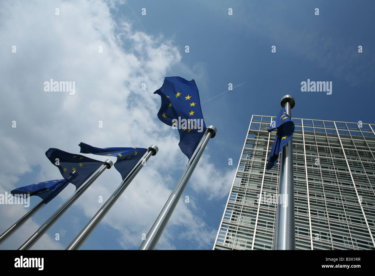 European flags in the wind fronting the Berlaymont building in Brussels ...