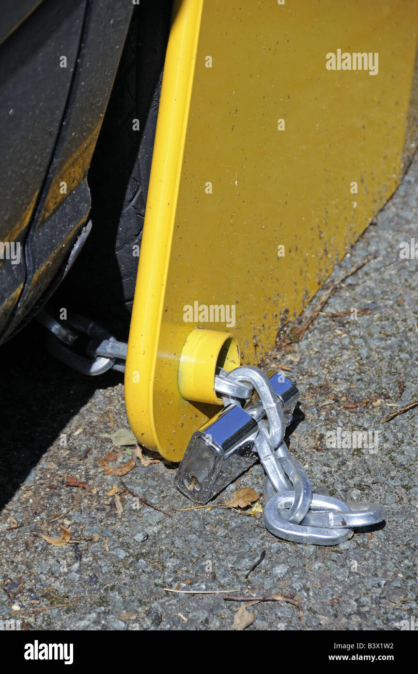 Close up of wheel clamp with chain London England UK Stock Photo - Alamy