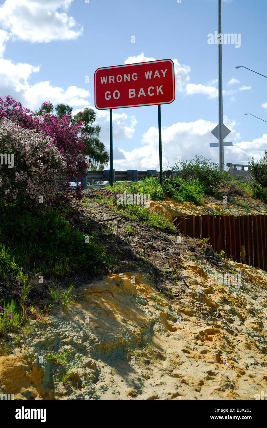 Red and white "Wrong Way, Go Back" sign Stock Photo - Alamy