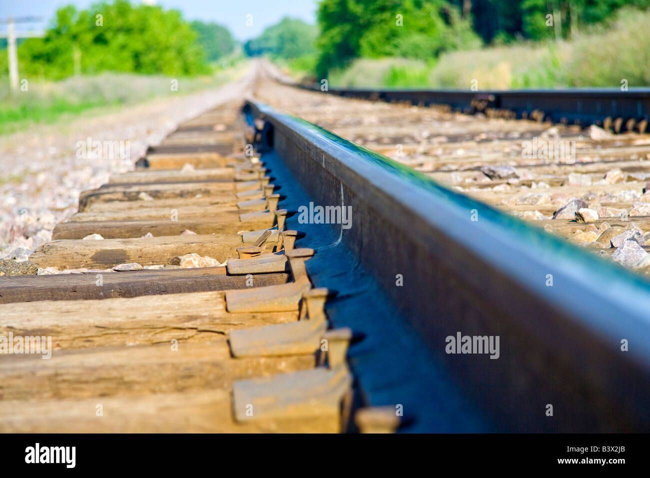 Train tracks fading towards the horizon Stock Photo - Alamy