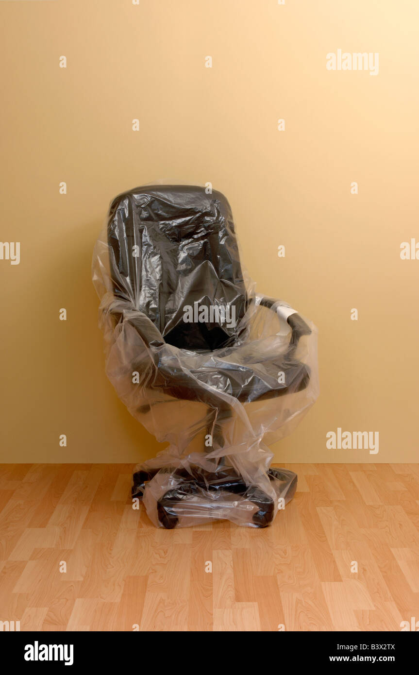 Office chair wrapped in polythene Stock Photo - Alamy