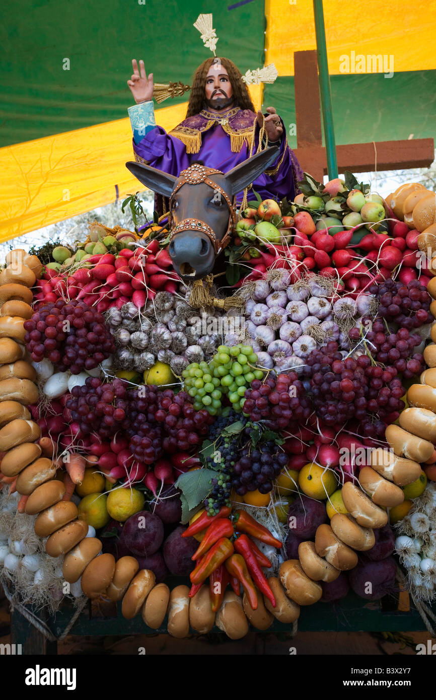 Statue of Christ decorated with fruit, vegetables and bread arrangement ...