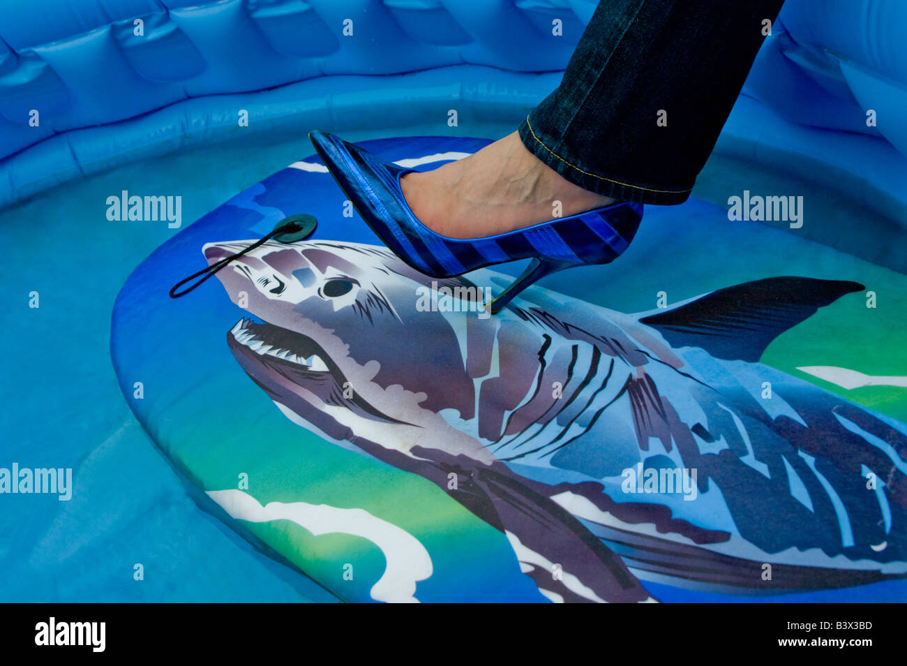 CLoseup of a foot next to an image of a shark Stock Photo - Alamy