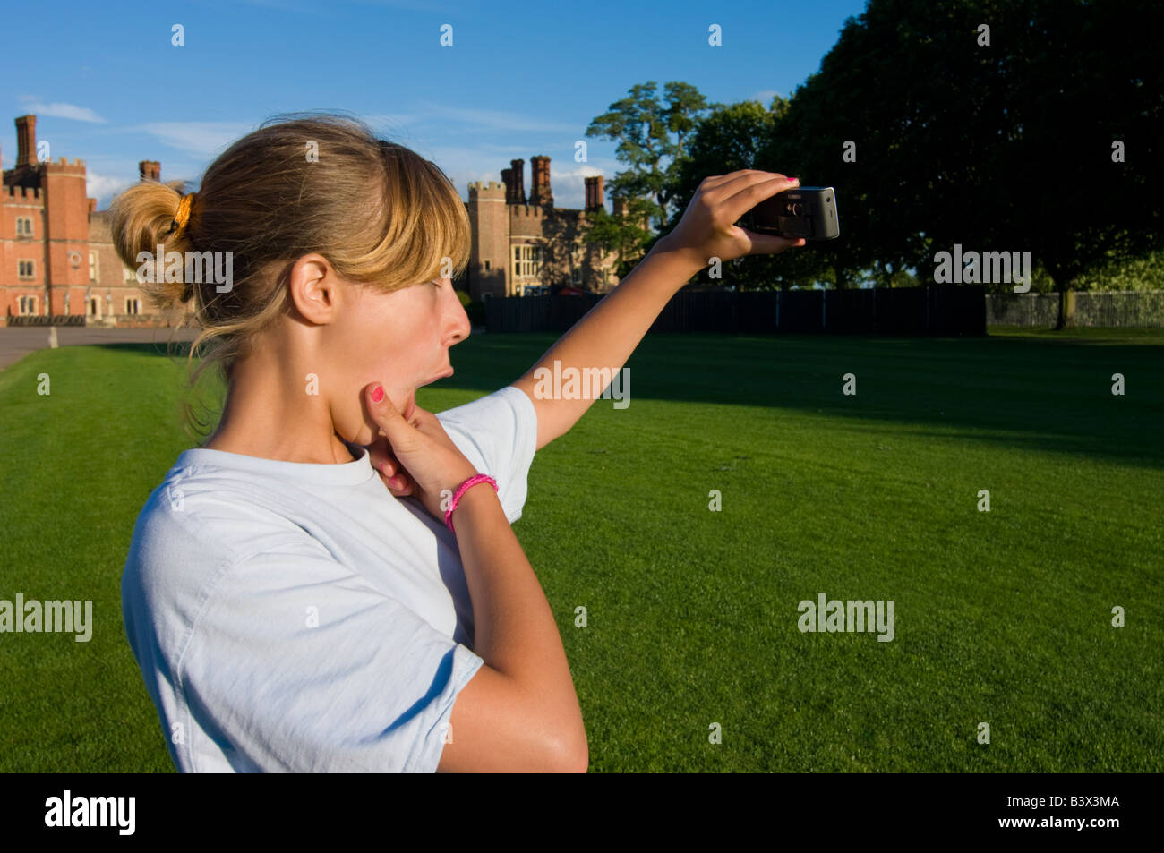 child gawking at mobile phone screen Stock Photo - Alamy