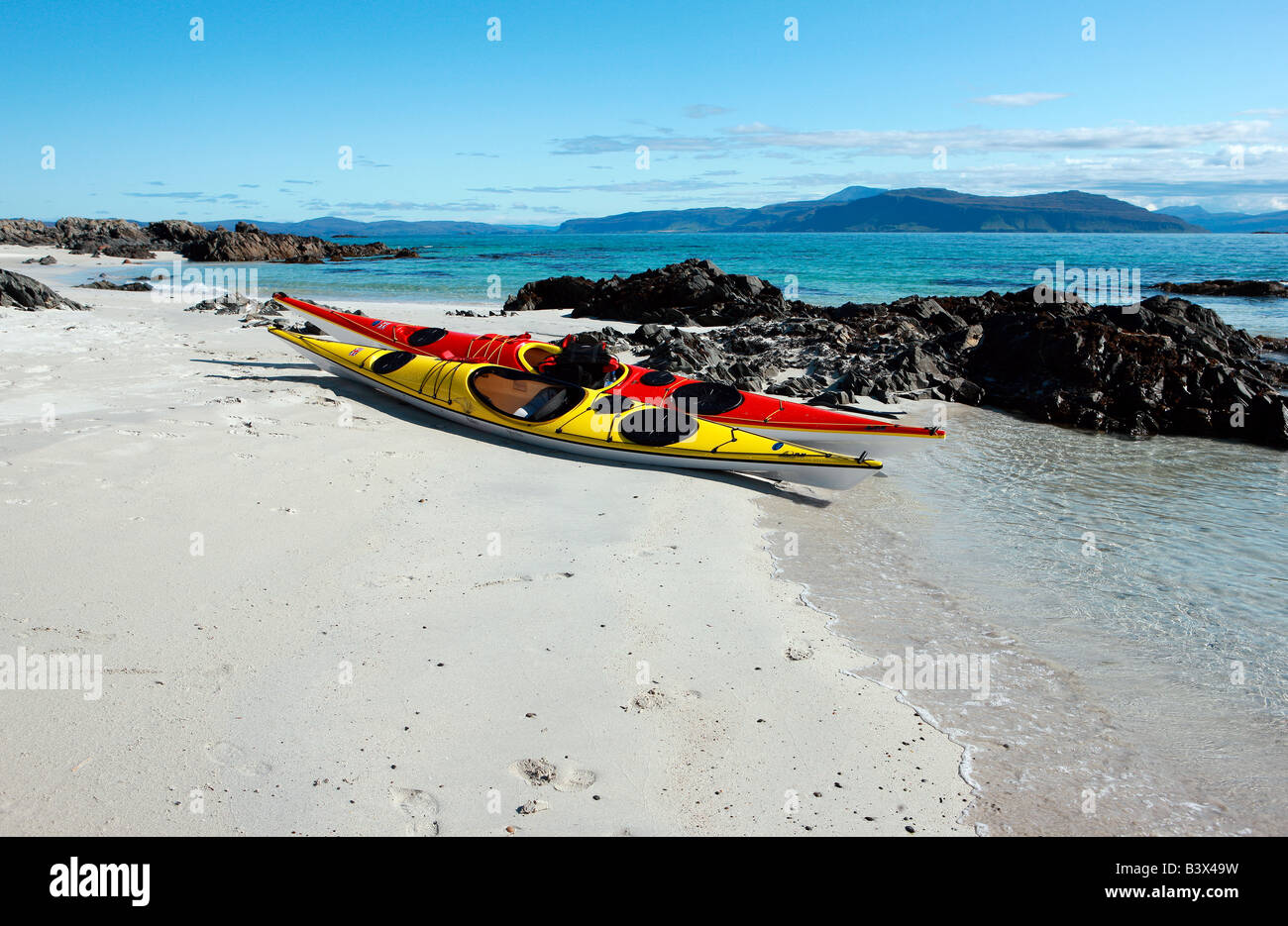 Kayaks on a beach Stock Photo - Alamy