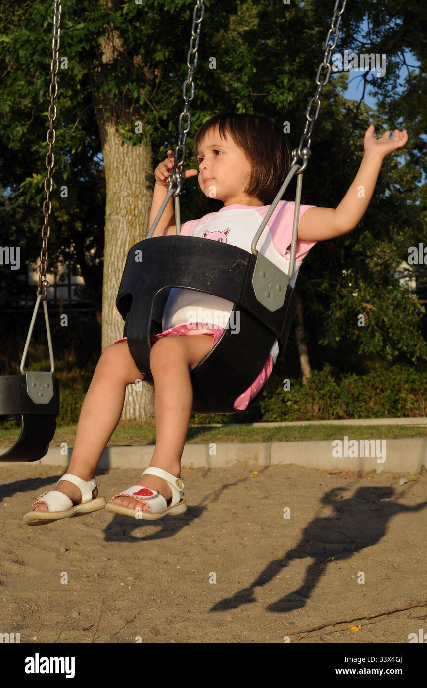 Girl in a swing Stock Photo - Alamy