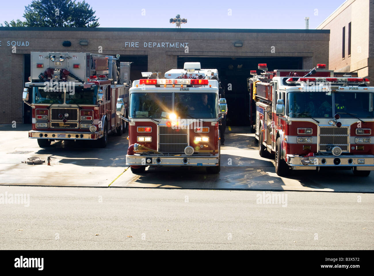 Firetruck leaving station Stock Photo - Alamy