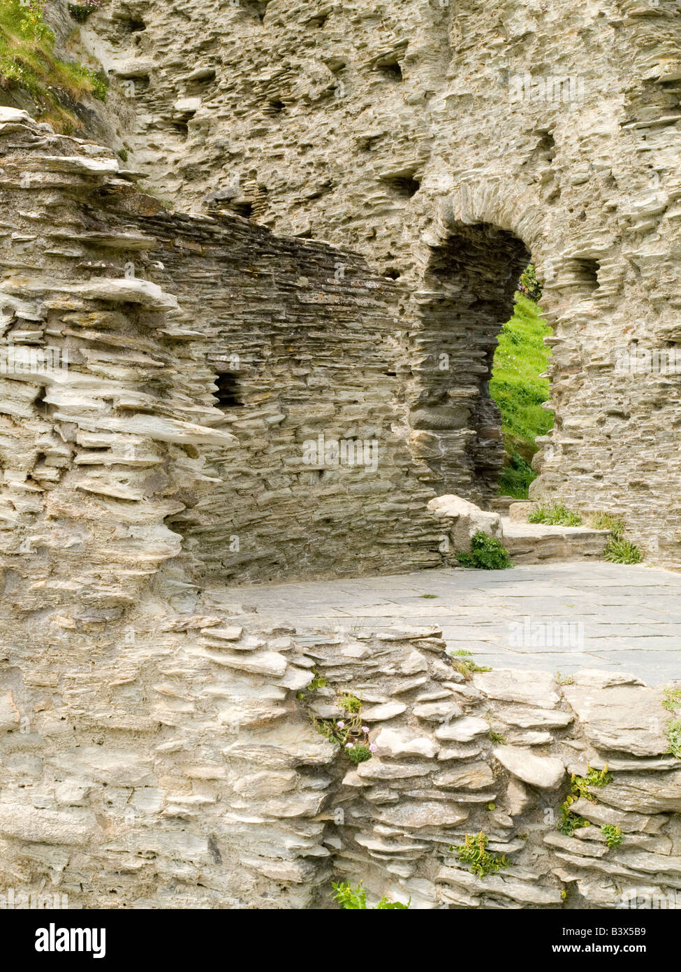 Some of the stone walls that form the ruins of Tintagel Castle ...