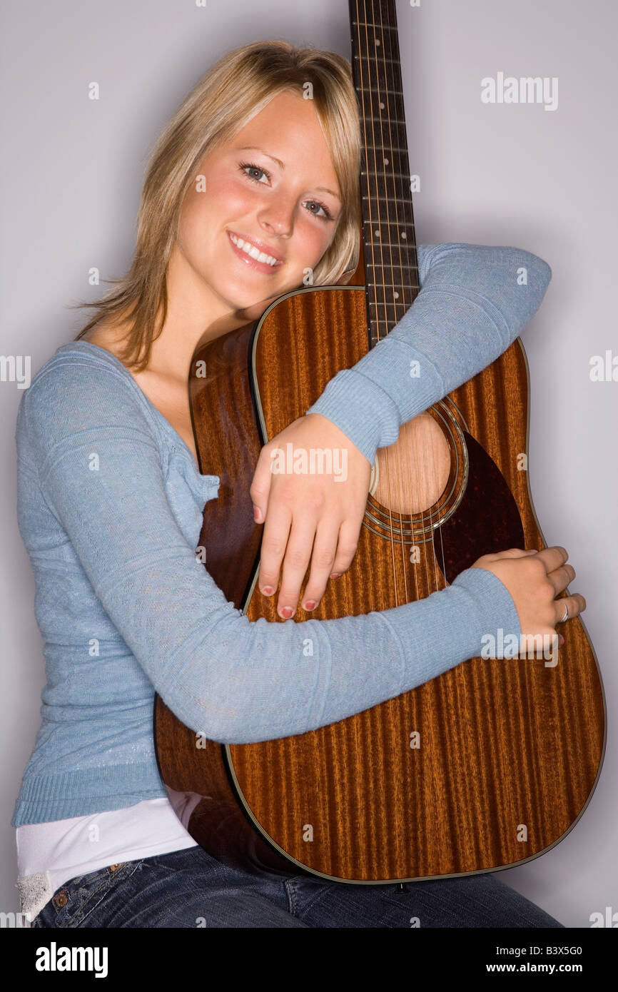 Woman with a guitar Stock Photo - Alamy