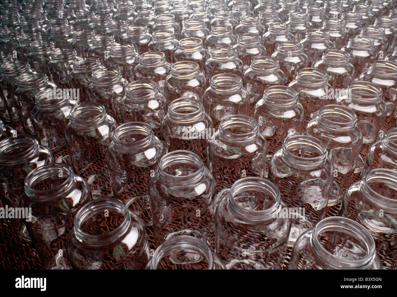 Glass bottles on the assembly line of a glass product manufacturing ...