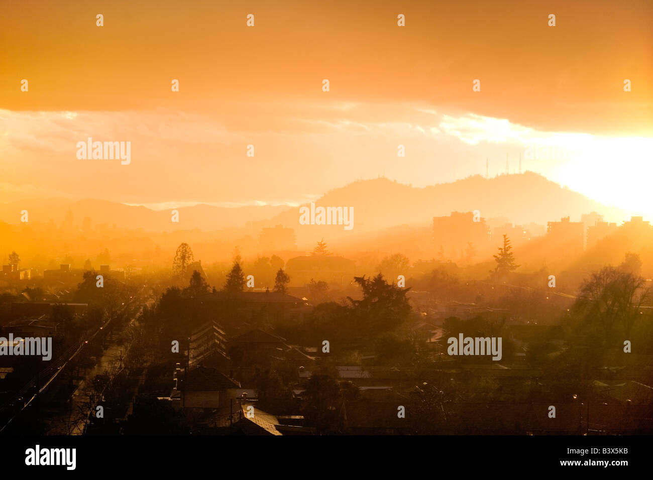 Sunset in Santiago de Chile in a rainy day Stock Photo - Alamy
