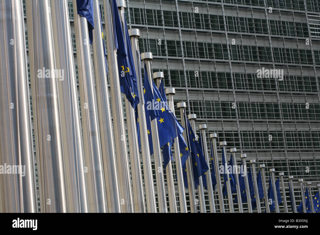 European flags in the wind fronting the Berlaymont building in Brussels ...