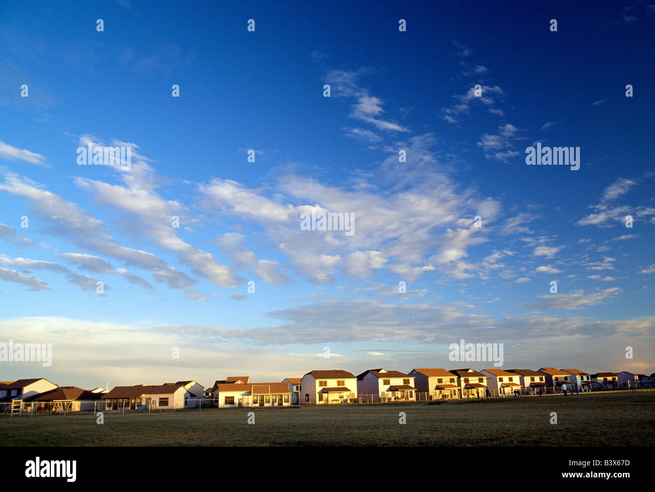 Dramatic sky at sunset over residential housing community, Clovis, New ...