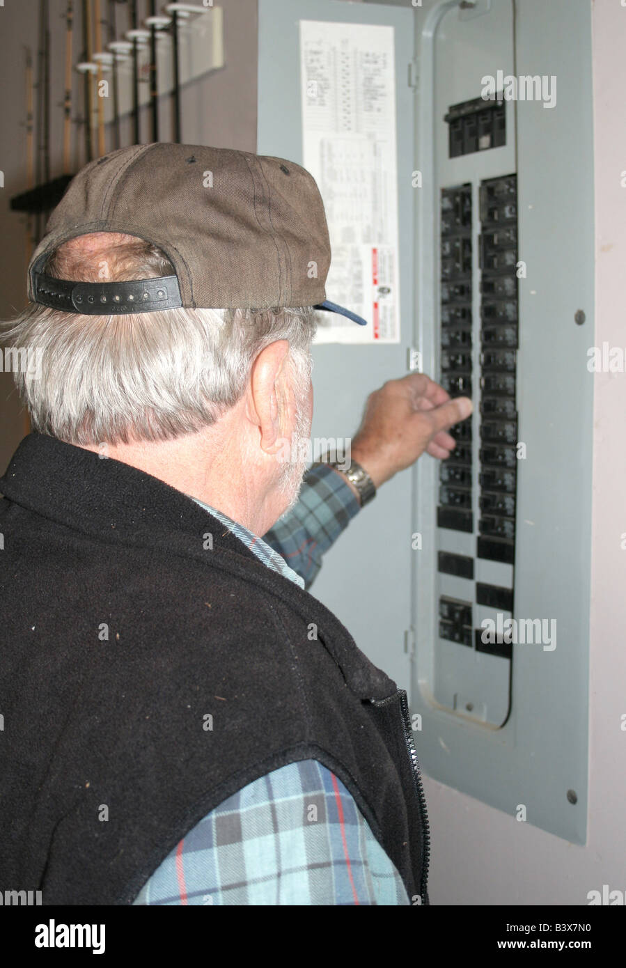 Man working on electrical box Stock Photo - Alamy