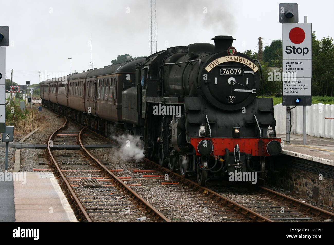 76079 with the Cambrian steam excursion approaching Harlech station ...
