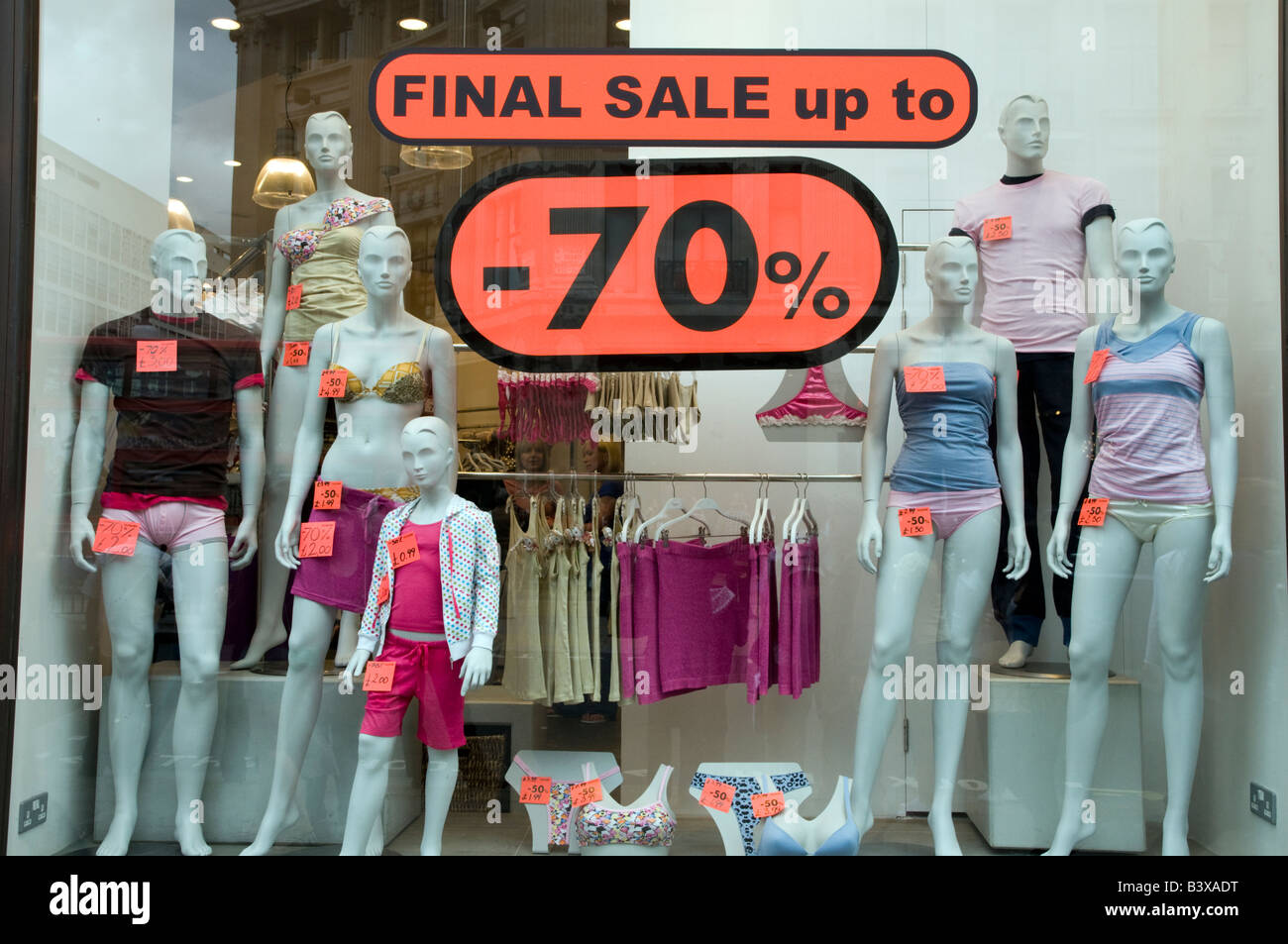 Sales in clothes shop window London England UK Stock Photo - Alamy