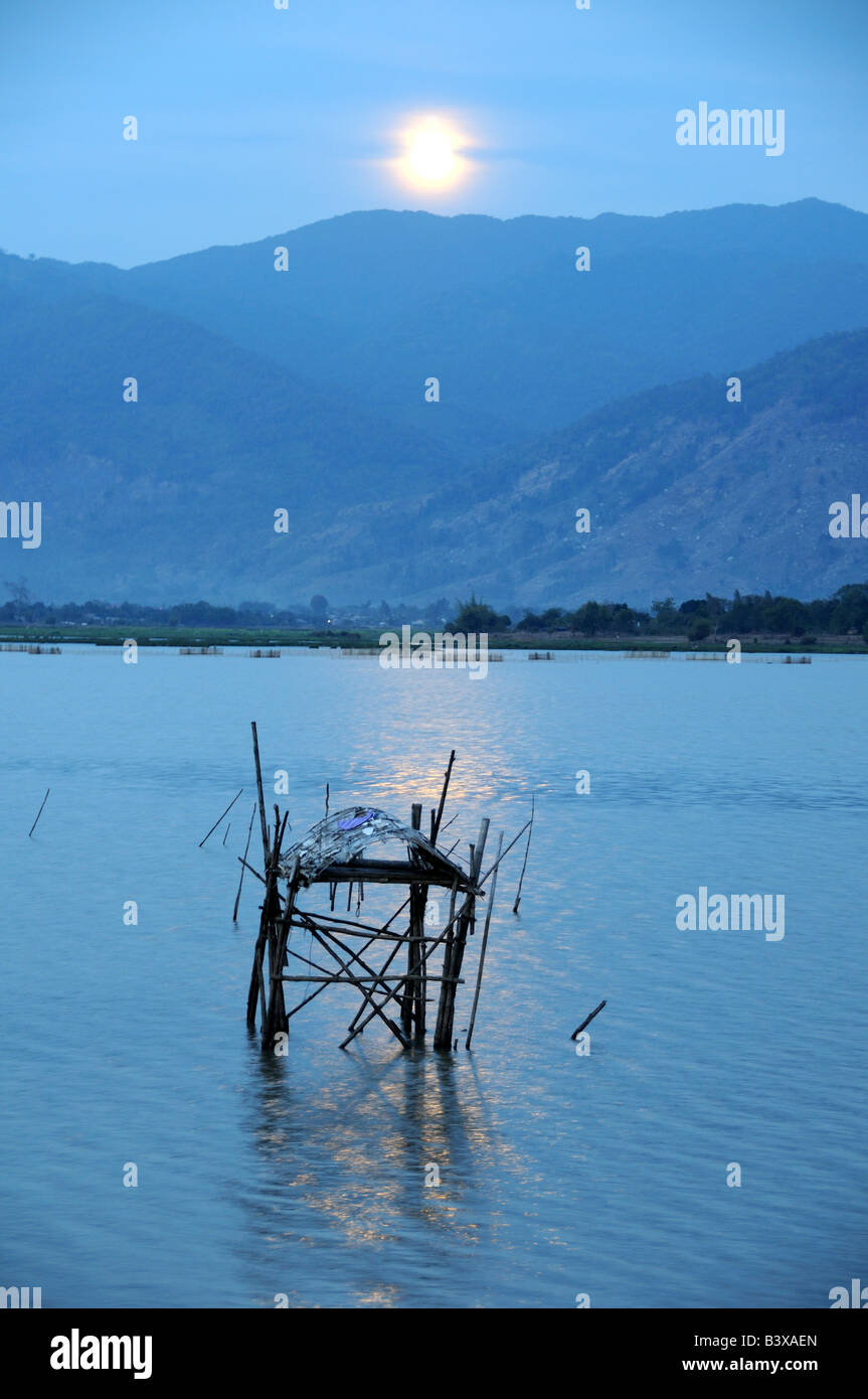 Full moon rising over Lak Lake Vietnam Stock Photo - Alamy