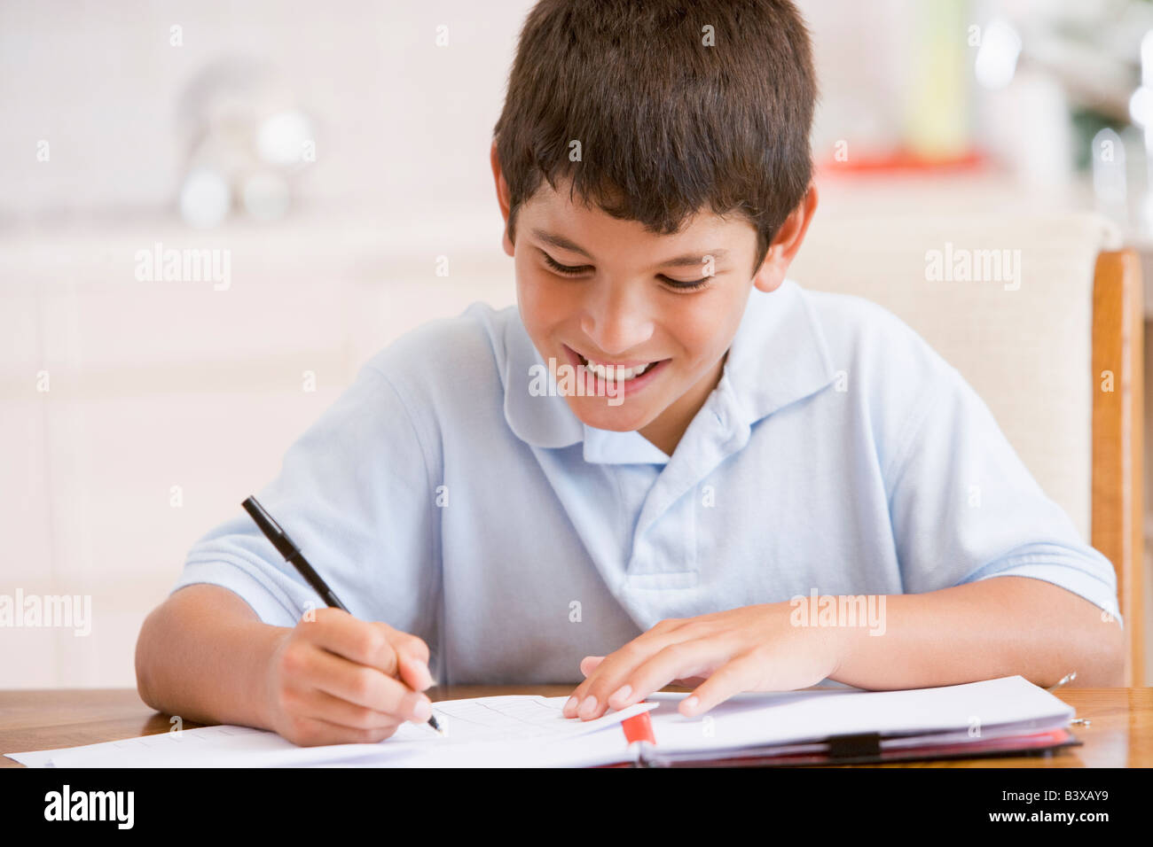 Happy pre teen boy studying hi-res stock photography and images - Alamy