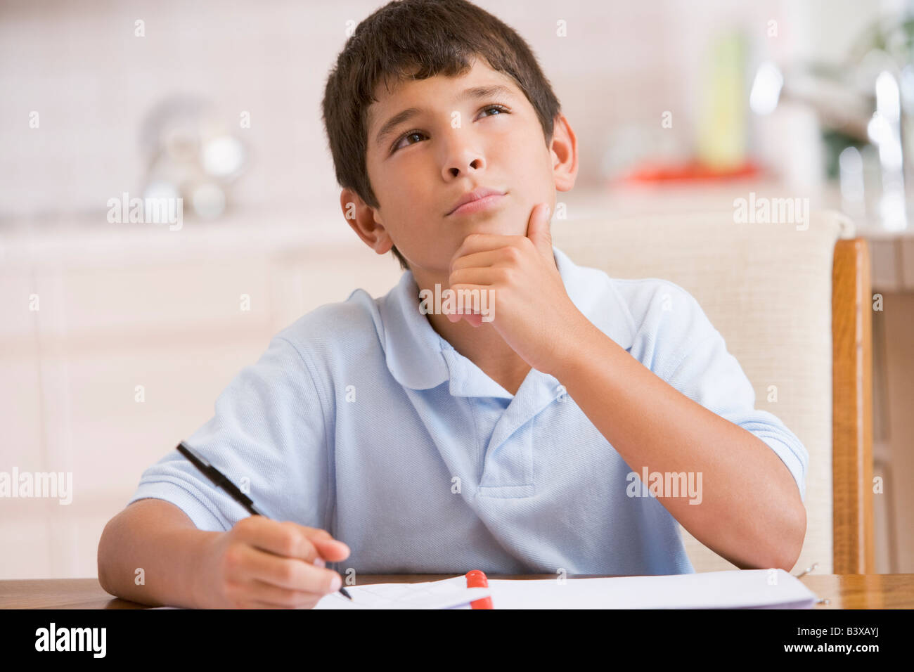 Boy Doing His Homework Stock Photo - Alamy