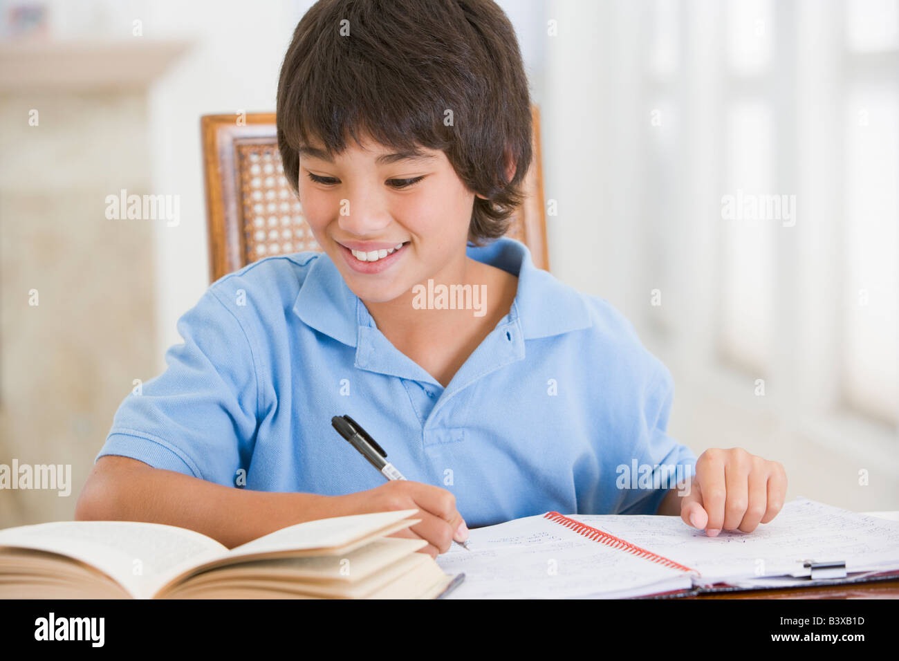 Boy Doing His Homework Stock Photo - Alamy