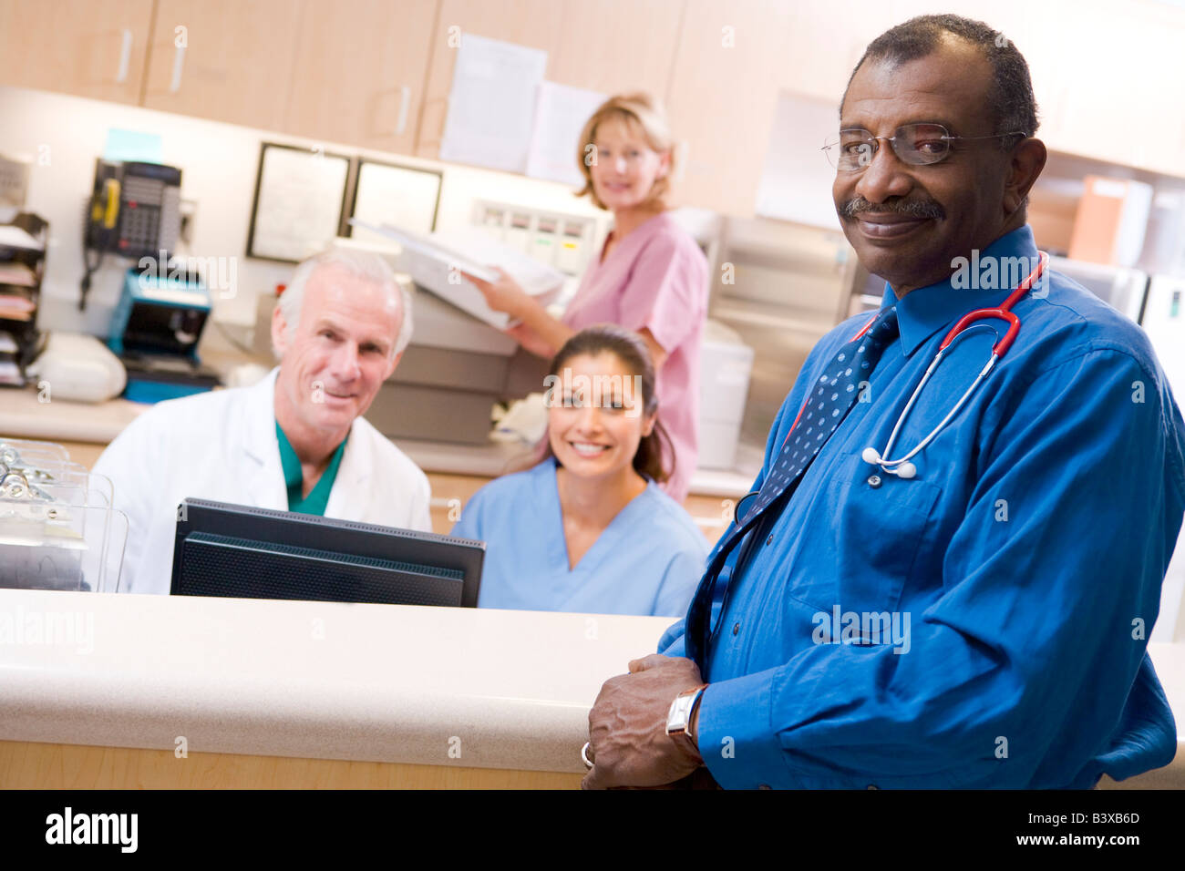 Doctors And Nurses At The Reception Area Of A Hospital Stock Photo - Alamy