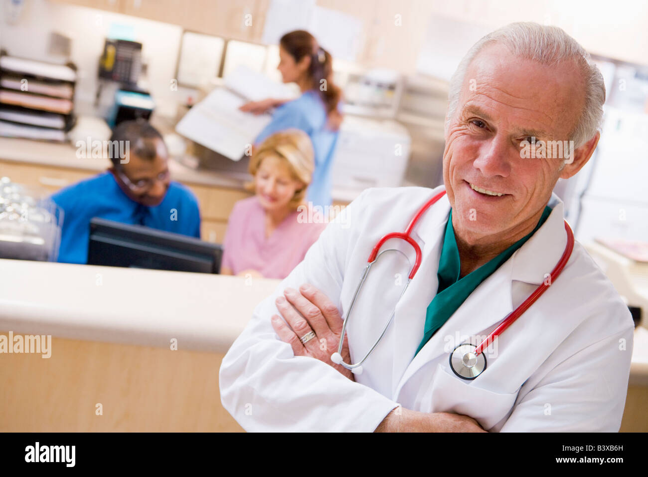 Doctors And Nurses At The Reception Area Of A Hospital Stock Photo - Alamy