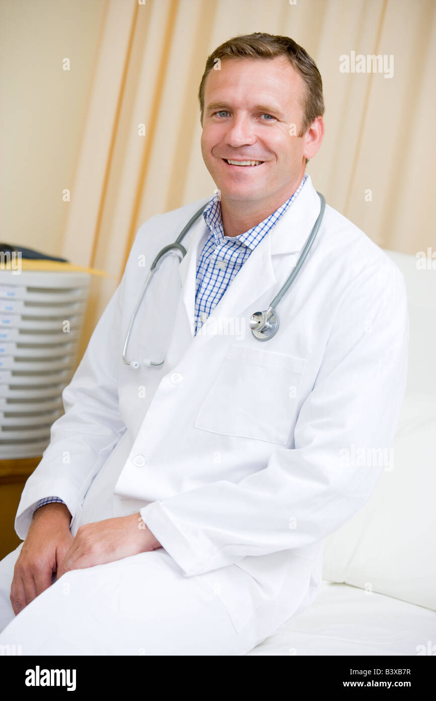 A Doctor Sitting On A Hospital Bed Stock Photo - Alamy