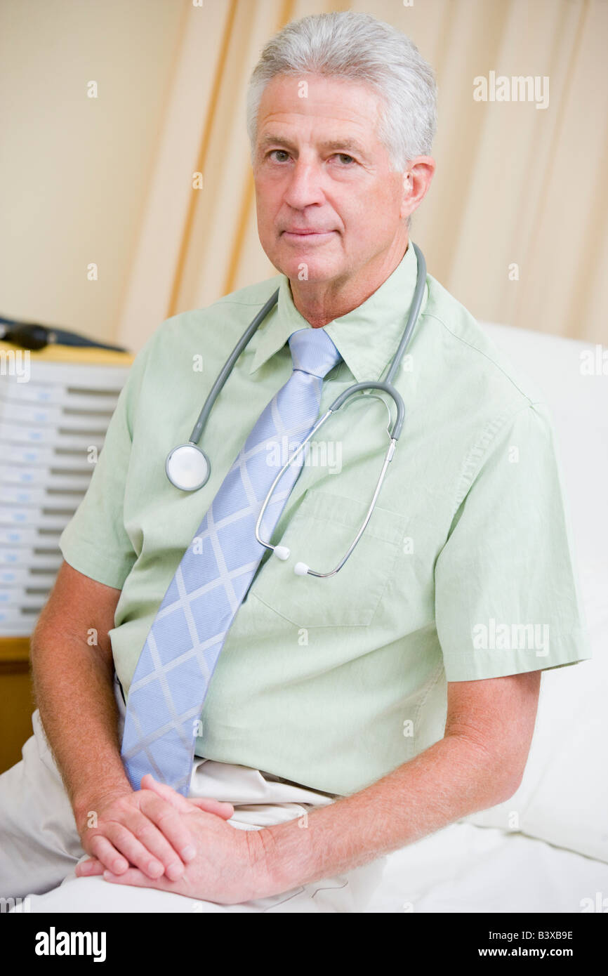 A Doctor Sitting On A Hospital Bed Stock Photo - Alamy