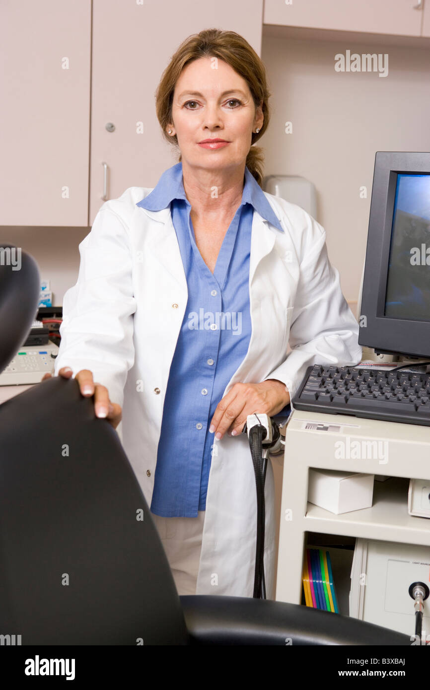 A Doctor Standing By A Computer Monitor Stock Photo - Alamy