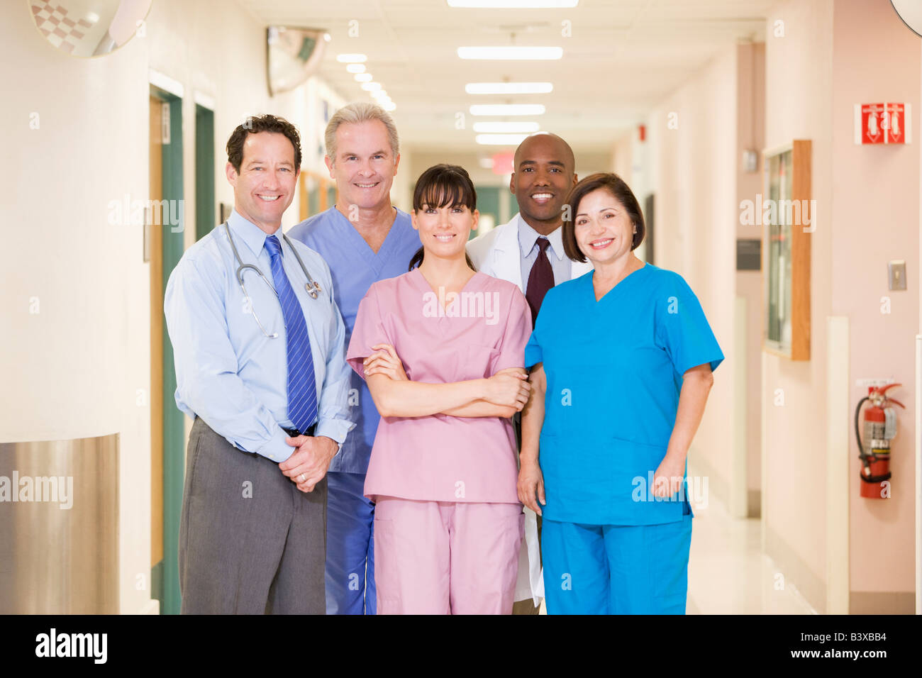 Hospital Team Standing In A Corridor Stock Photo - Alamy