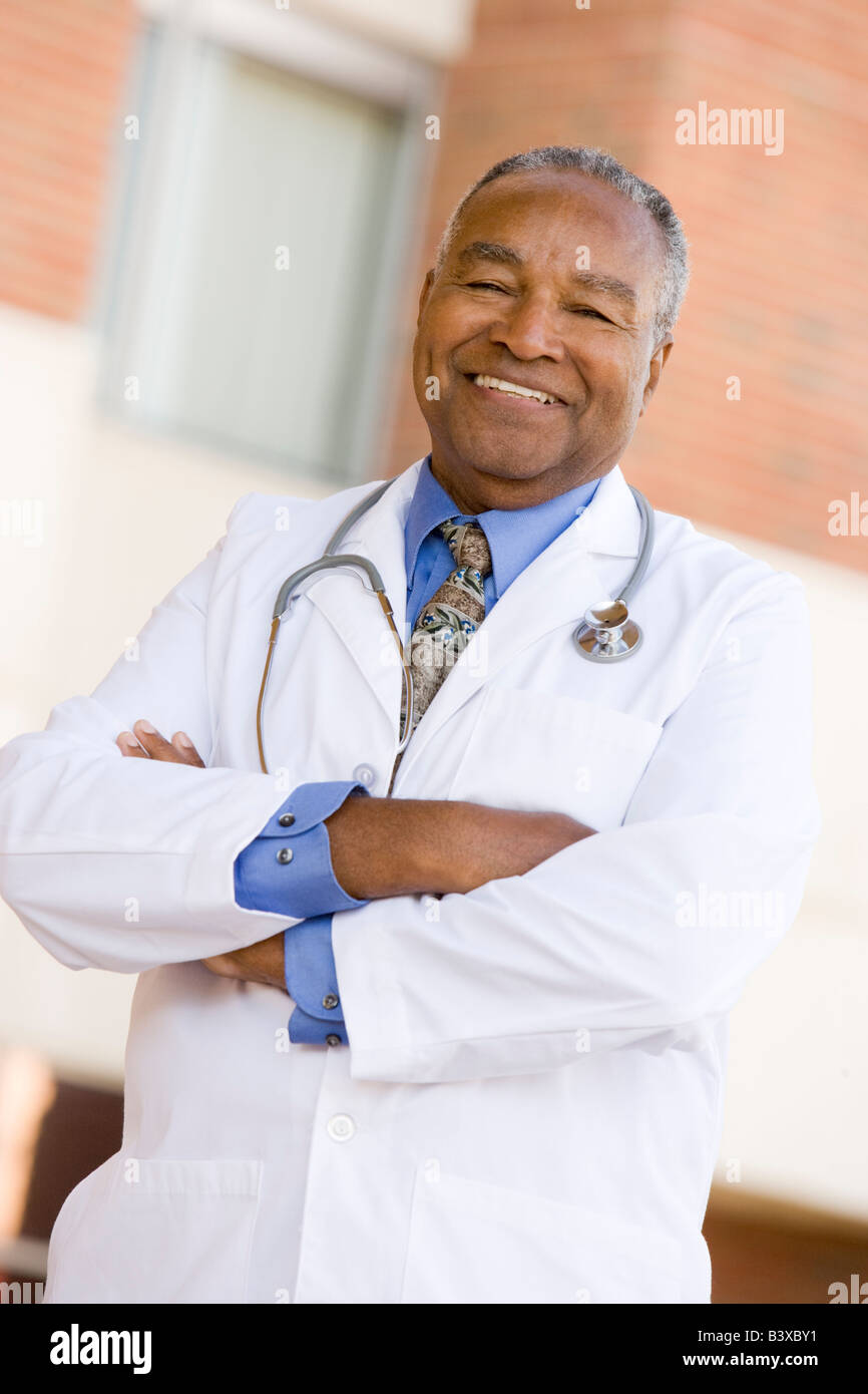Doctor Standing Outside A Hospital Stock Photo - Alamy