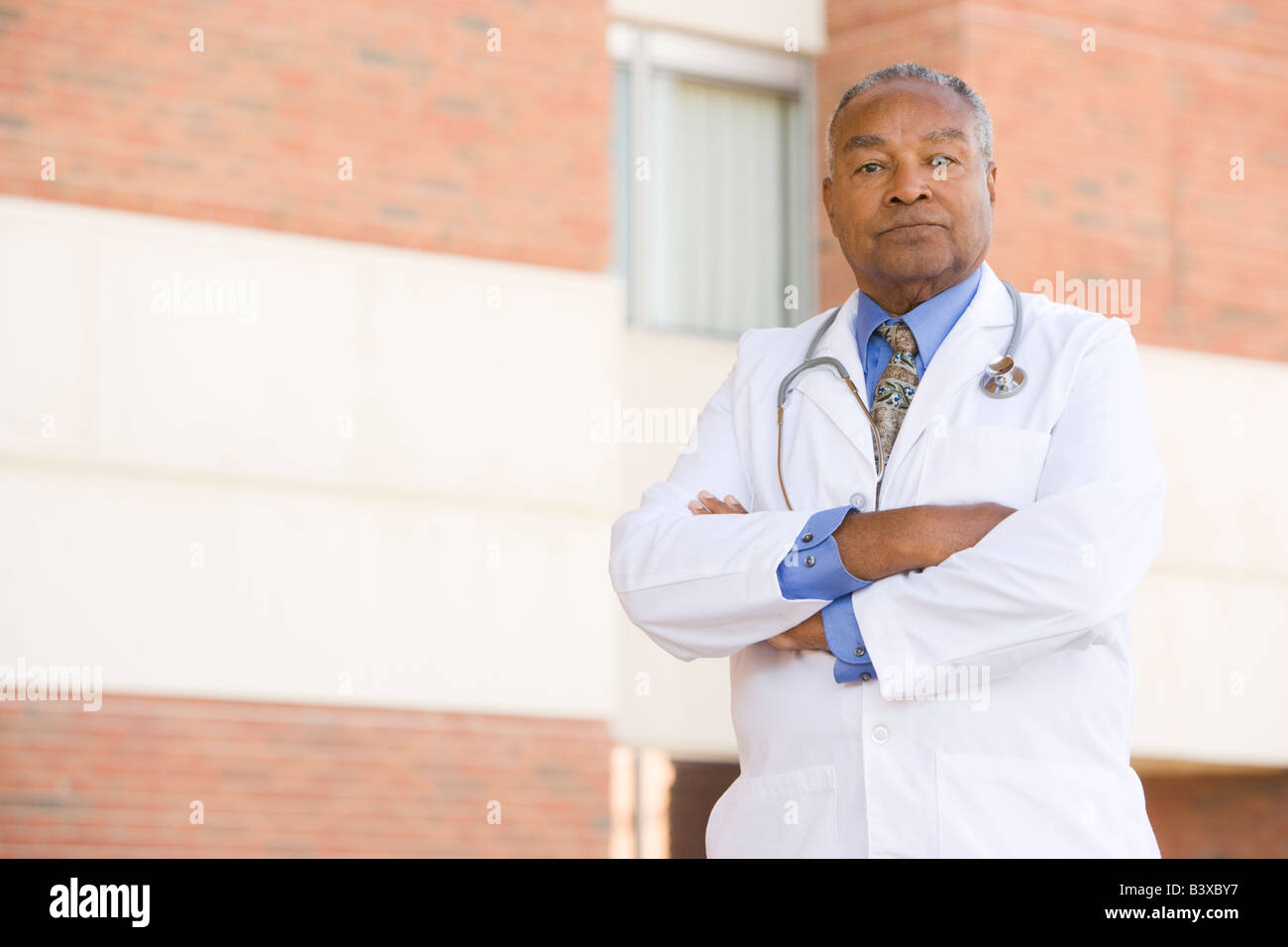 Doctor Standing Outside A Hospital Stock Photo - Alamy
