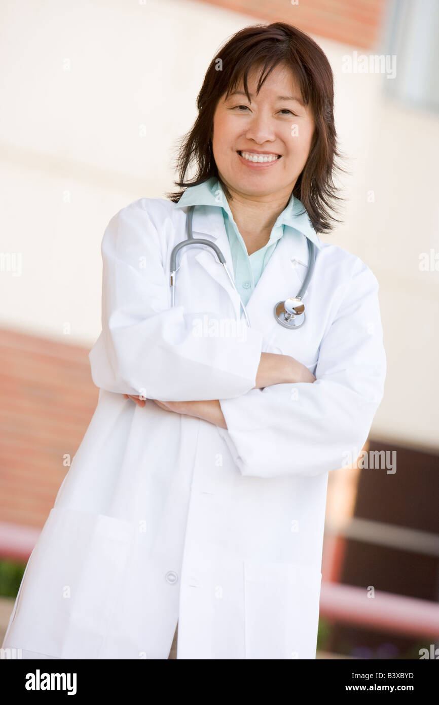 Doctor Standing Outside A Hospital Stock Photo - Alamy