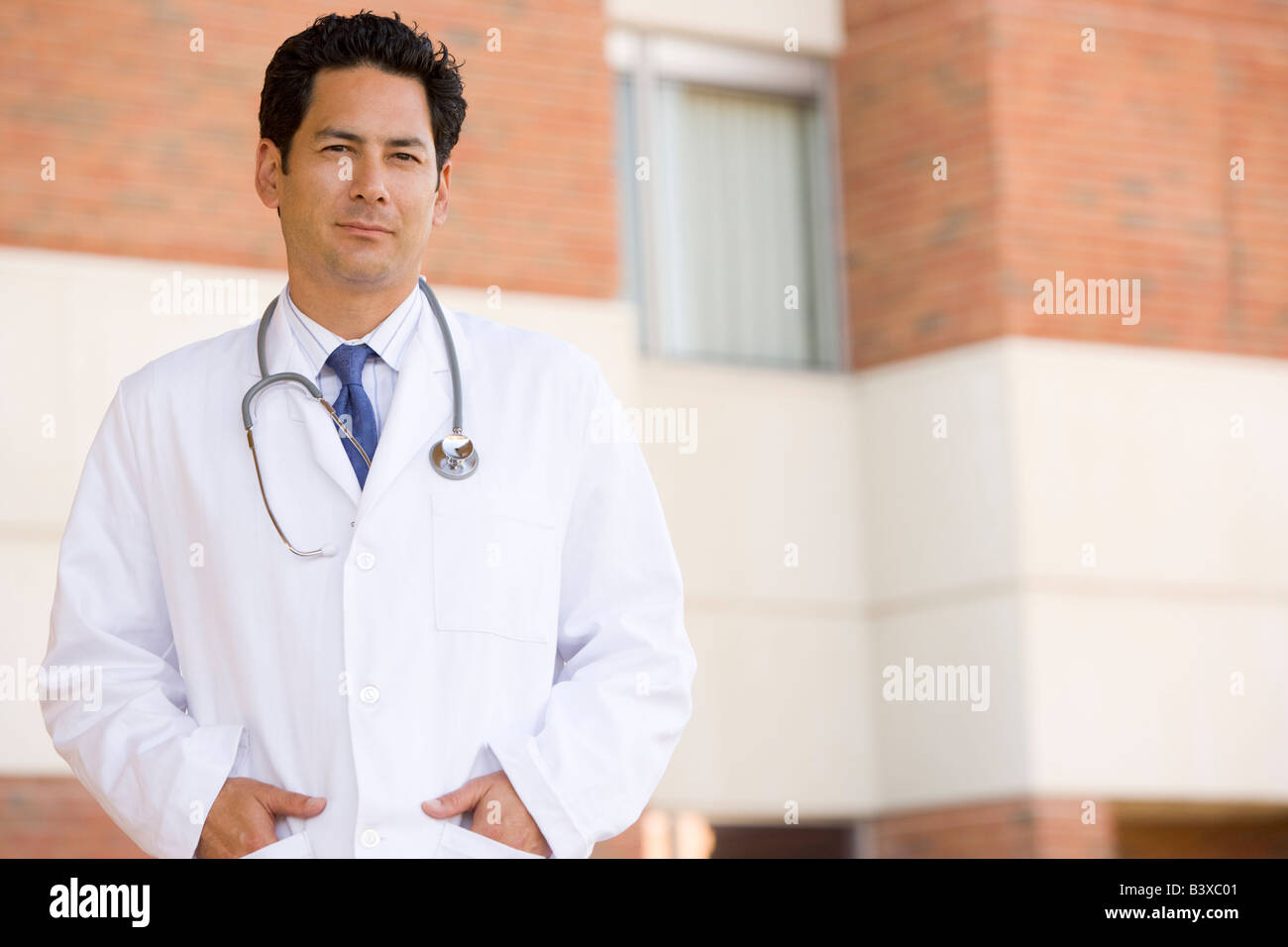 Doctor Standing Outside A Hospital Stock Photo - Alamy