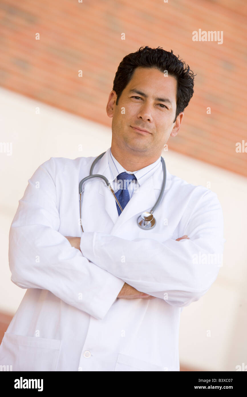 Doctor Standing Outside A Hospital Stock Photo - Alamy