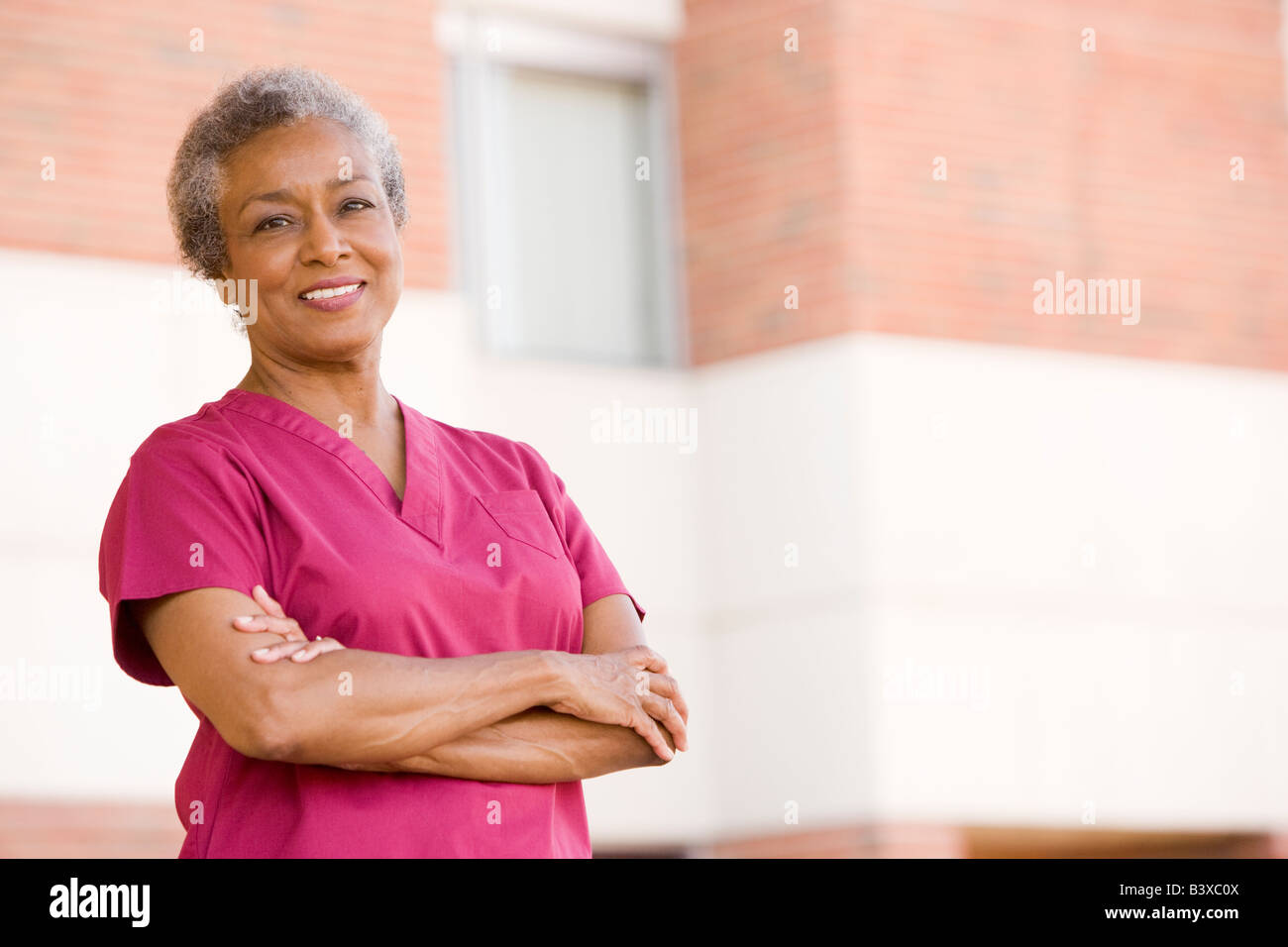 Nurse Standing Outside A Hospital Stock Photo - Alamy