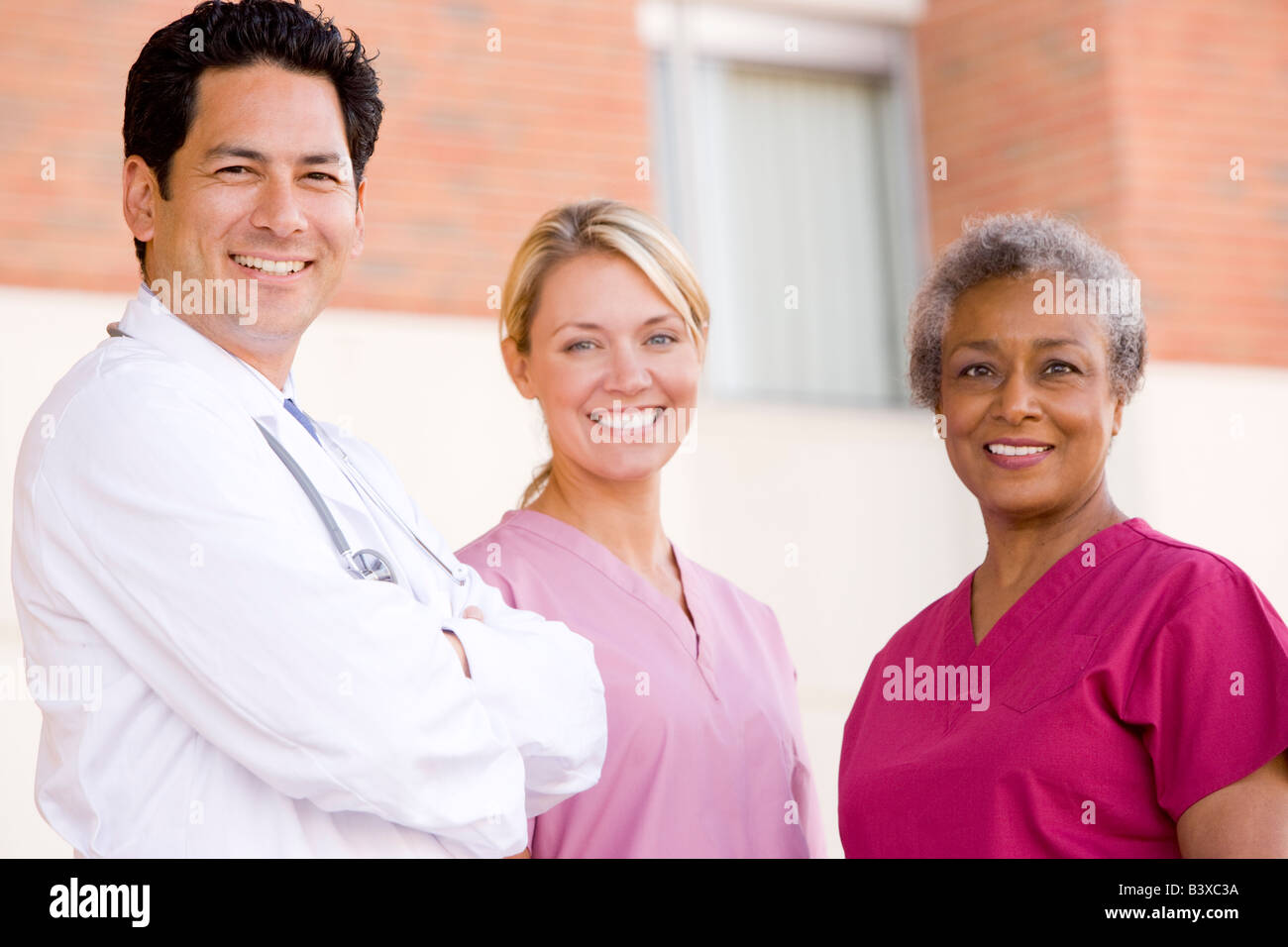 Doctor And Nurses Standing Outside A Hospital Stock Photo - Alamy