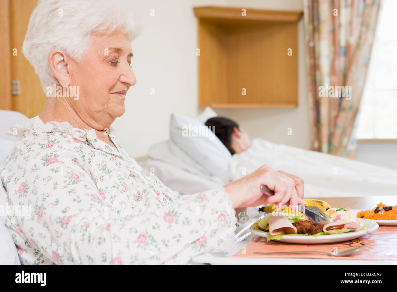 Senior Woman Eating Hospital Food Stock Photo - Alamy