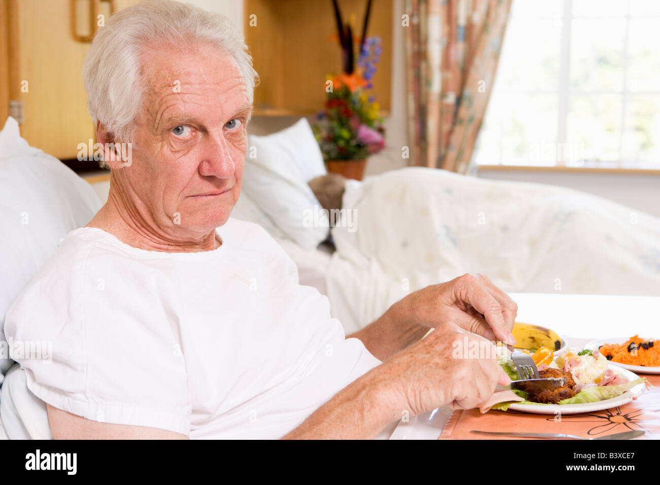 Senior Man Eating Hospital Food In Bed Stock Photo - Alamy
