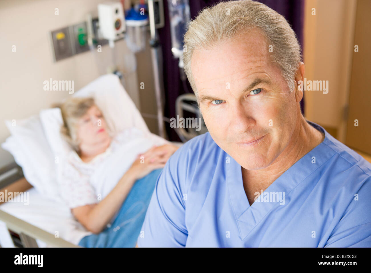 Doctor Standing In Patients Room, Looking Serious Stock Photo - Alamy