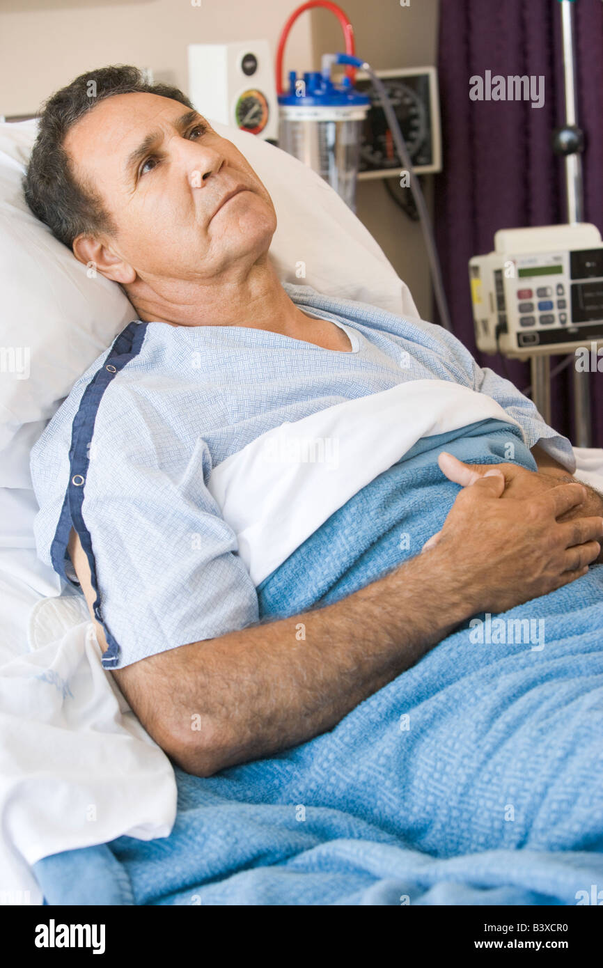 Middle Aged Man Lying In Hospital Bed Stock Photo - Alamy