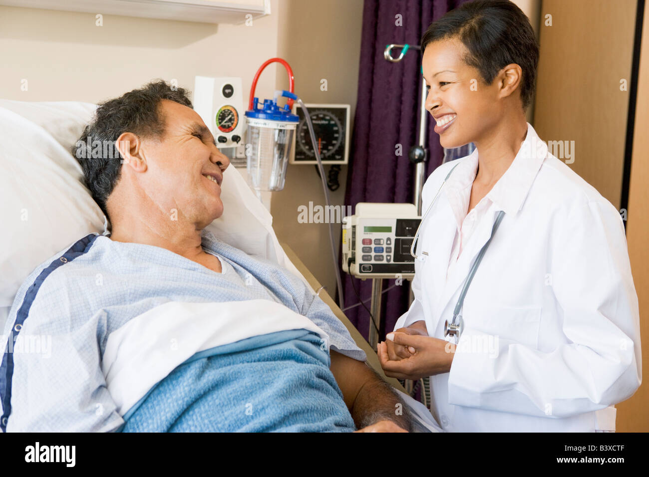 Doctor And Patient Talking To Each Other, Smiling Stock Photo - Alamy